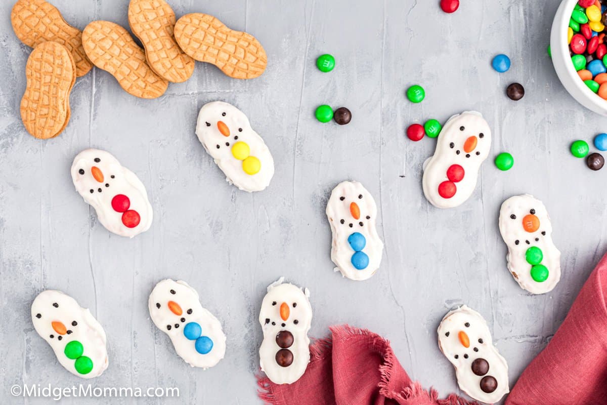 Chocolate Dipped Nutter Butter Snowman Cookies • MidgetMomma
